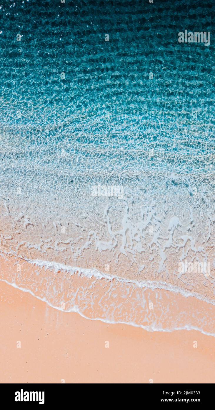 A beautiful aerial top view of sea waves washing the shore Stock Photo ...