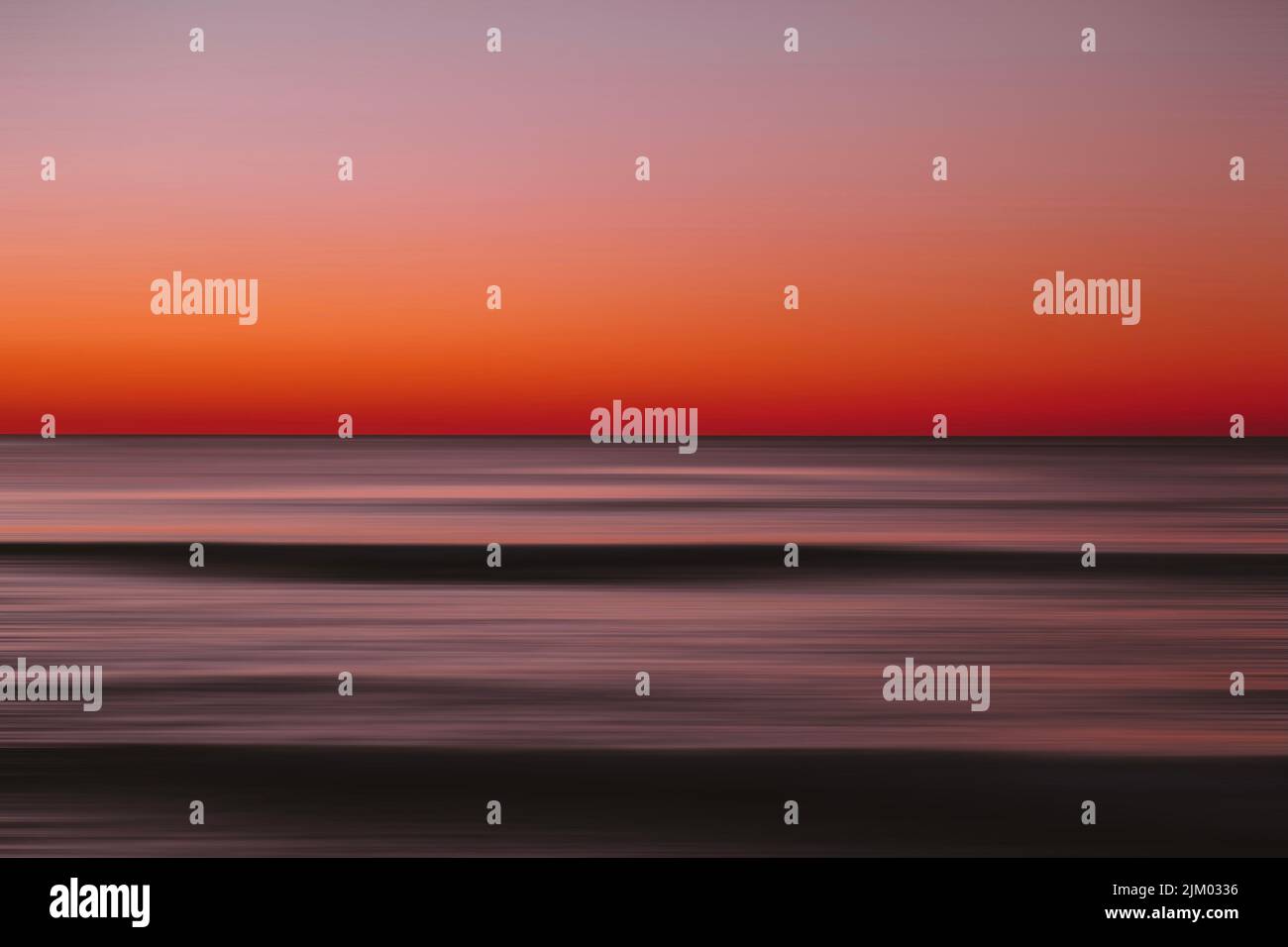 A scenic front view of horizon during sunset Stock Photo - Alamy