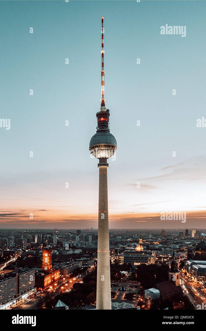 A vertical shot of the Berliner Fernsehturm, a tourist attraction in ...