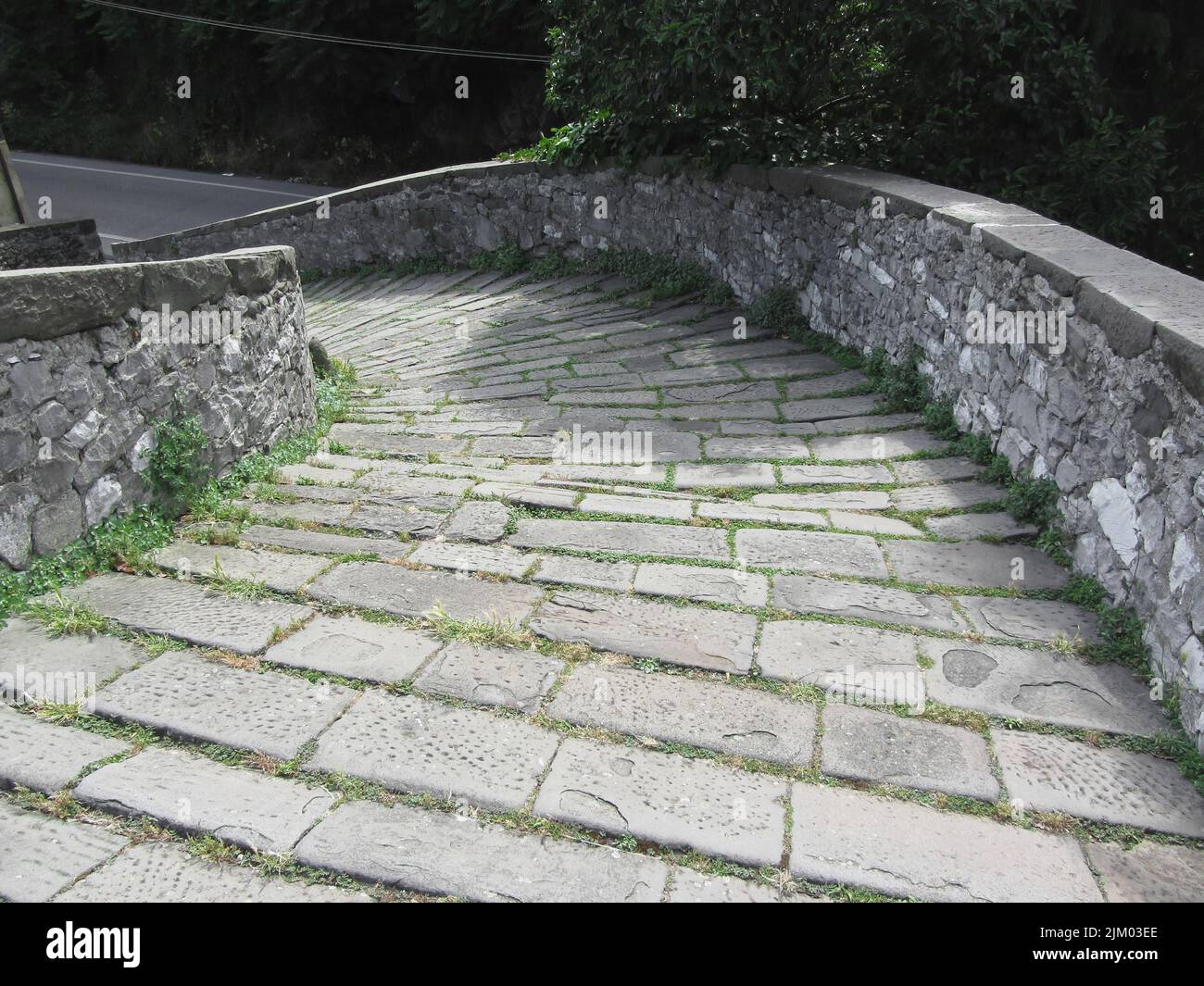 Descent stone walkway of medieval bridge known as Ponte del Diavolo in ...