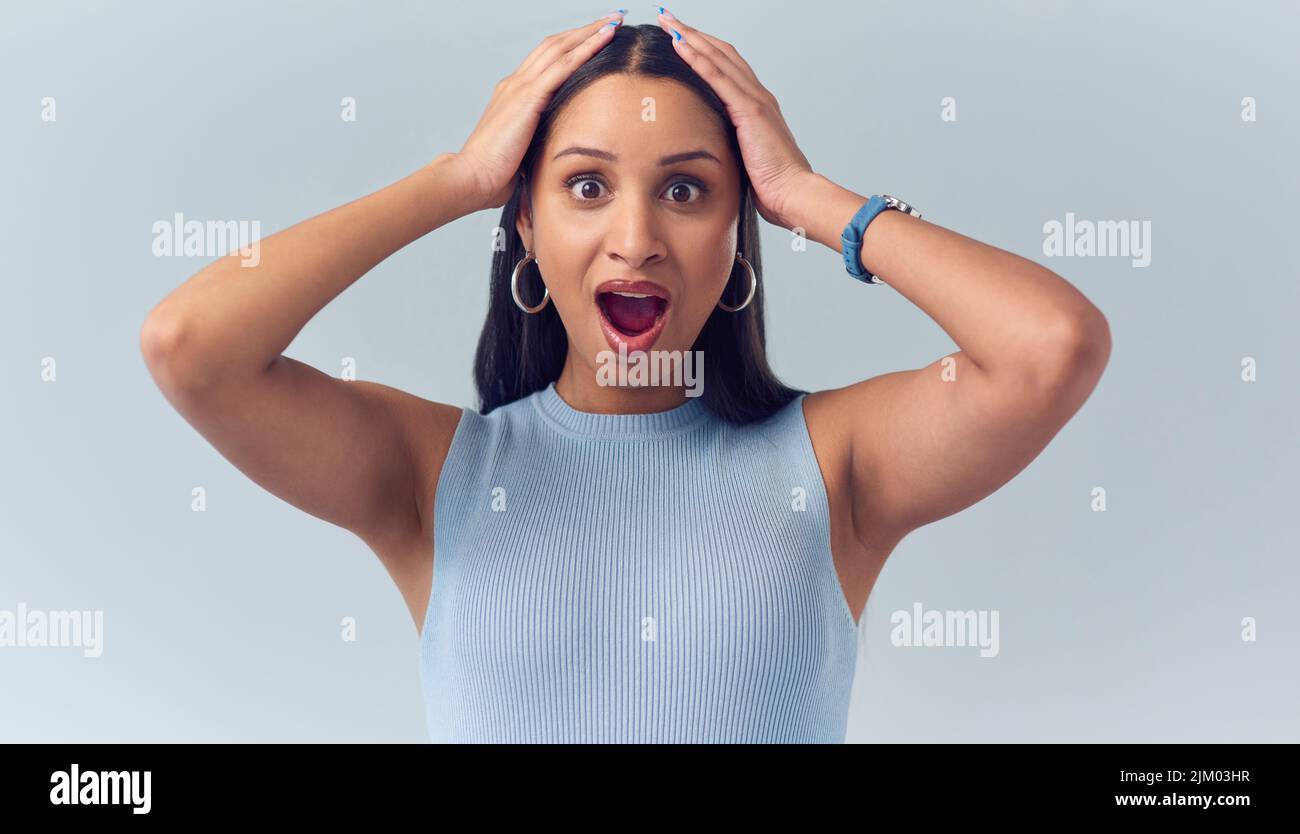 No way. Cropped portrait of an attractive young woman looking surprised ...