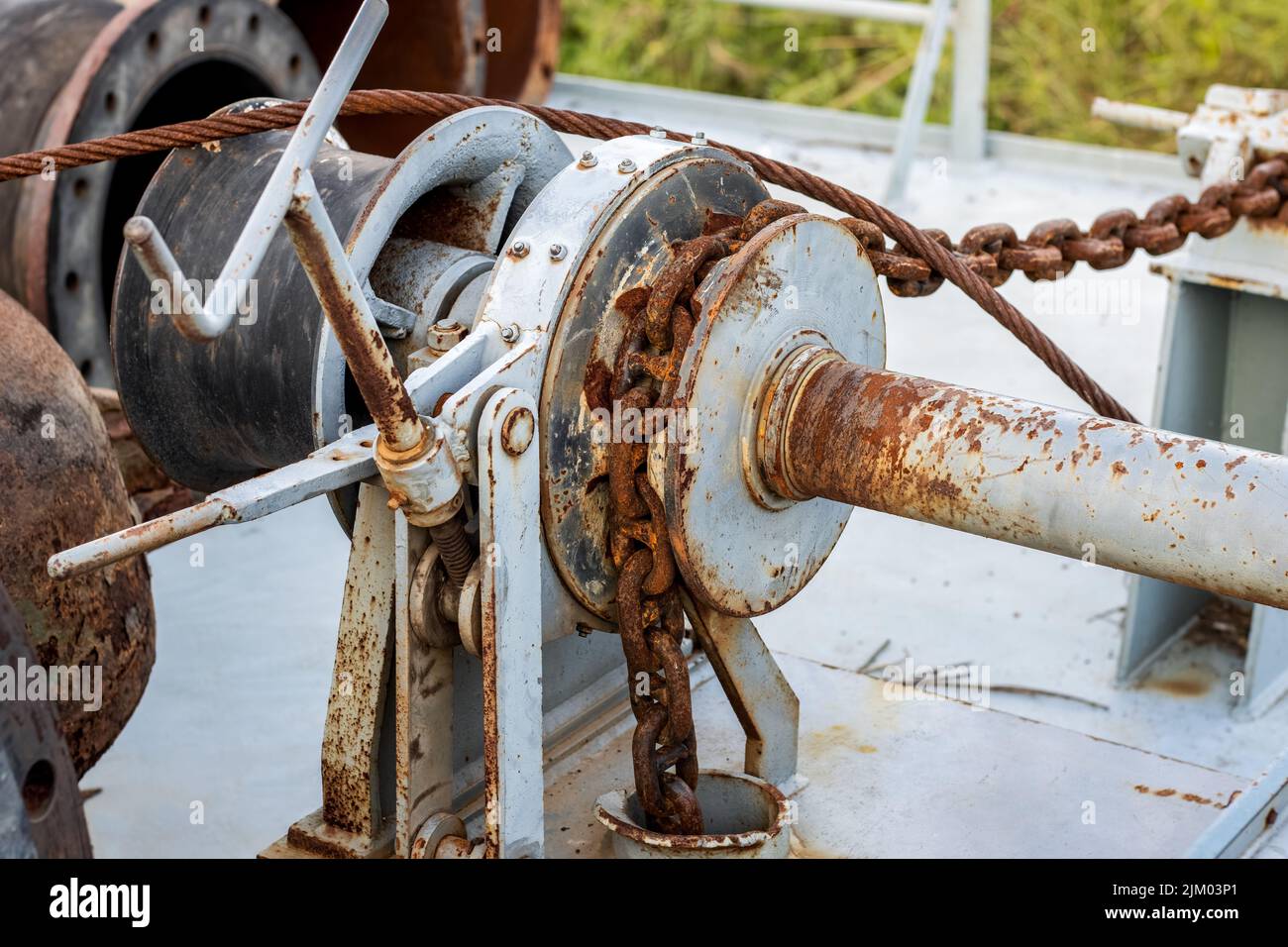 Selective focused old rustic ship anchor with an iron chain close up ...