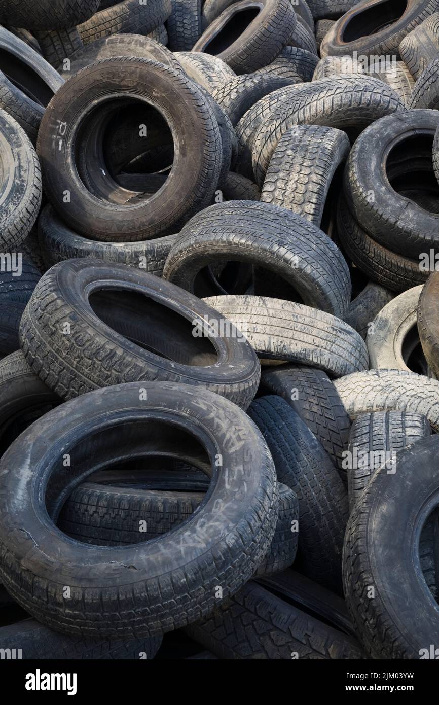 Pile of discarded truck tires at recycling yard Stock Photo - Alamy