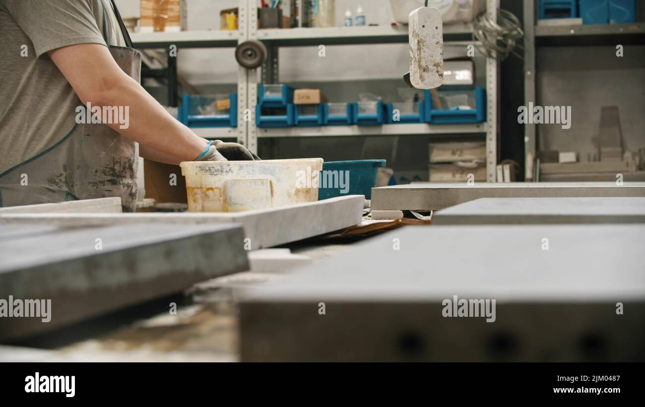 Working in the concrete industry - washing the concrete slab with water ...