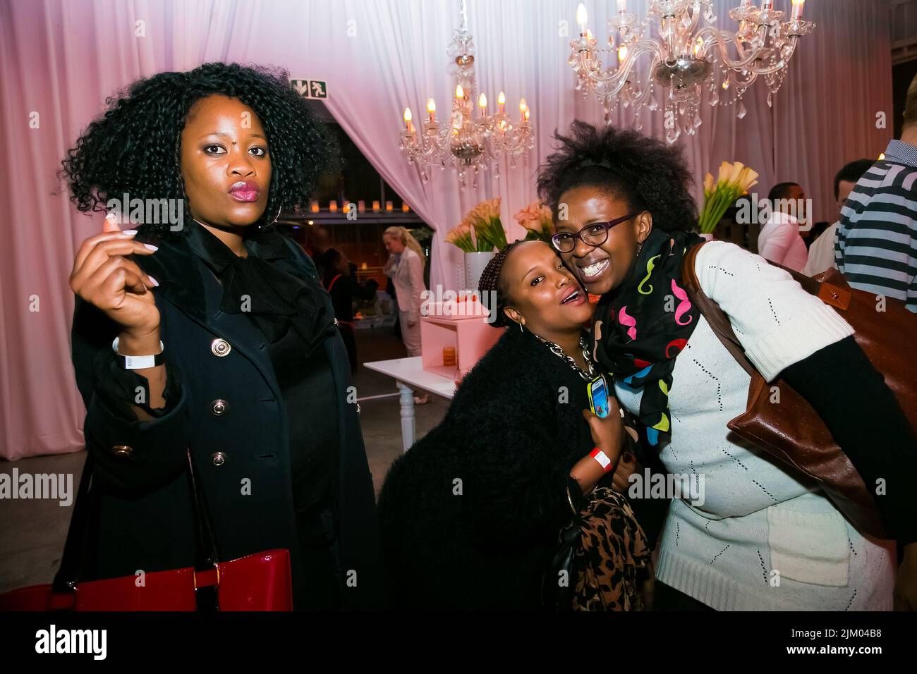 The beautiful African ladies posing for a photo at party in ...