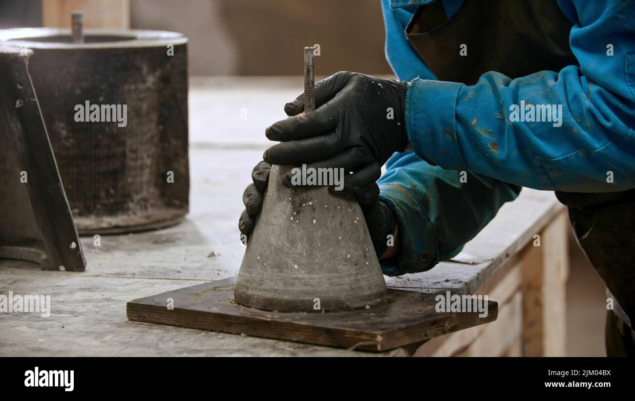 Concrete industry - worker preparing the form for working with concrete ...