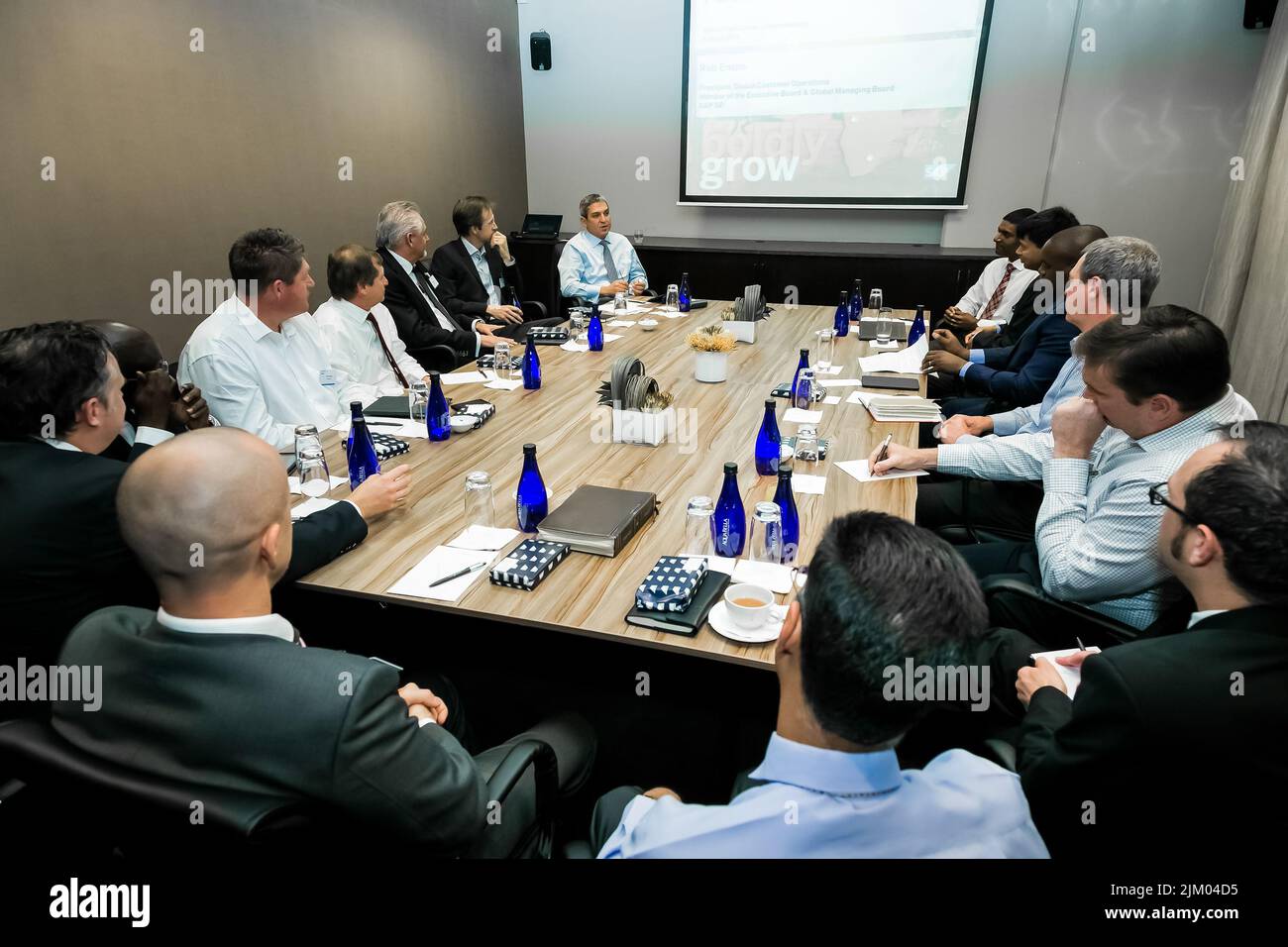 A boardroom meeting with multiracial managers and colleagues Stock ...