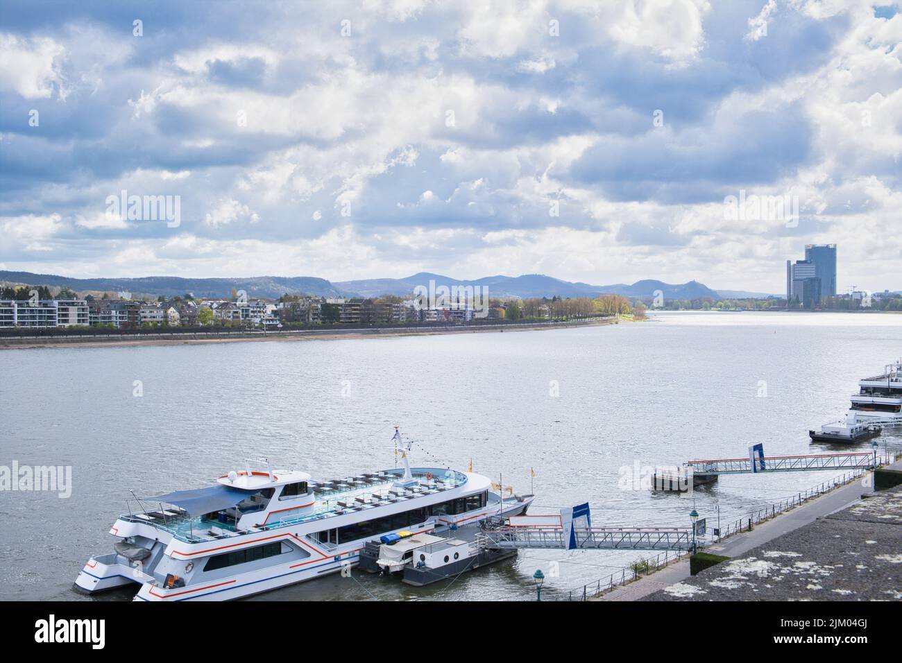 River bank of the Rhine in the city of Bonn, Germany, with a view of ...