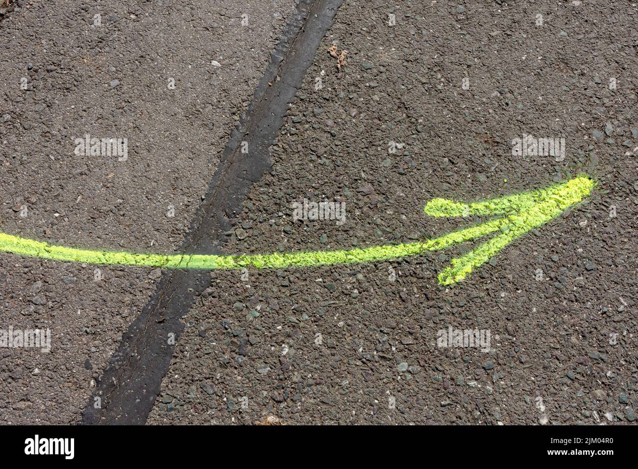 A painted arrow on the soil ground Stock Photo - Alamy