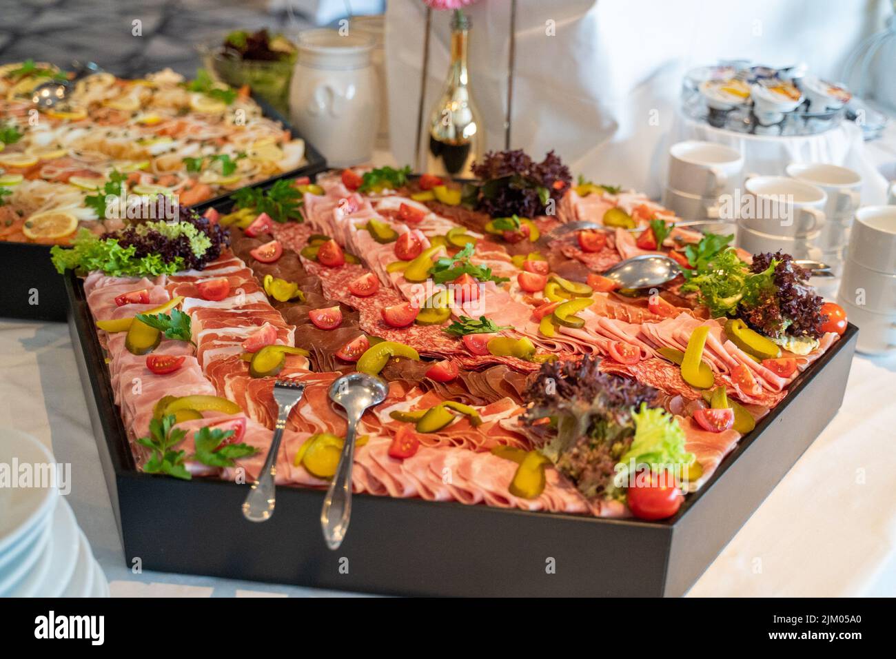 A closeup of a meat buffet with a large assortment at a restaurant ...