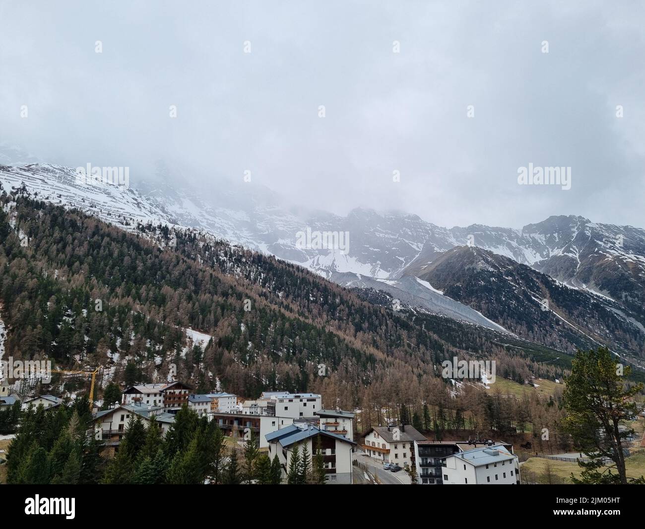 An aerial view of the beautiful snow-covered village of Sulden, Italy ...
