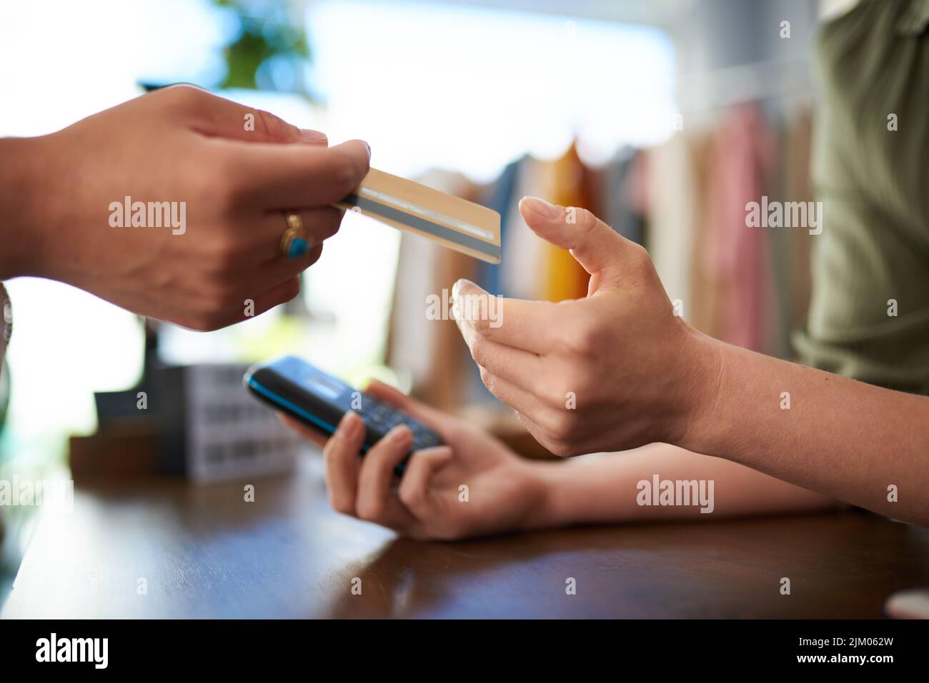 Make smart financial choices. a customer giving her card to make a ...