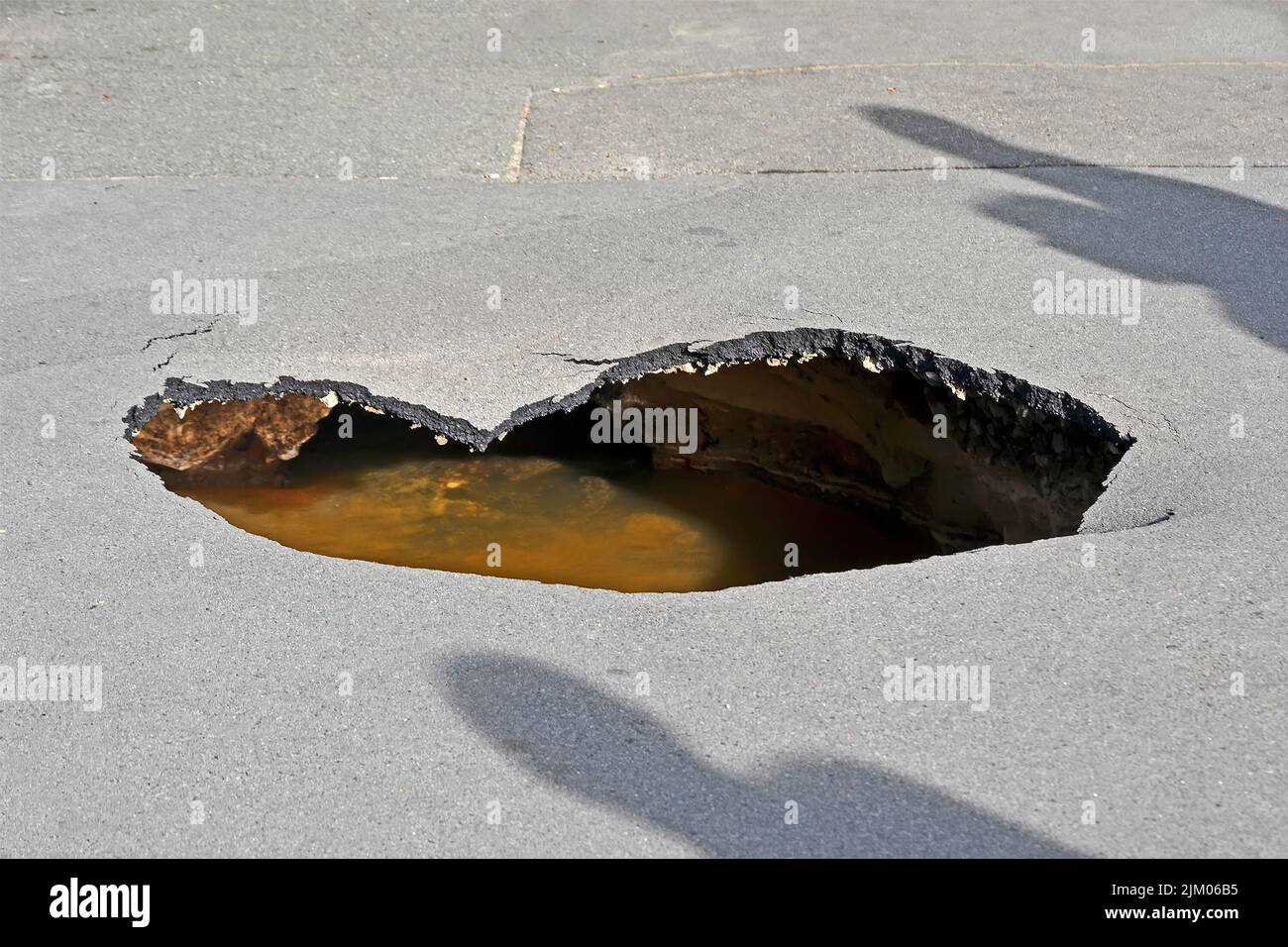 destroyed asphalt with big random hole, stress environment diversity ...