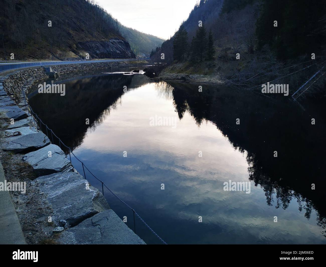 A breathtaking view of the Tysse river surrounded by mountains from a ...