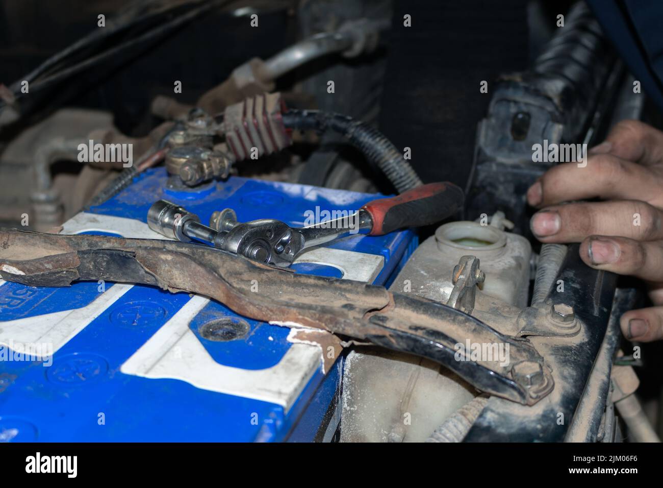 A closeup shot of a car engine with rust at a mechanic's station Stock ...