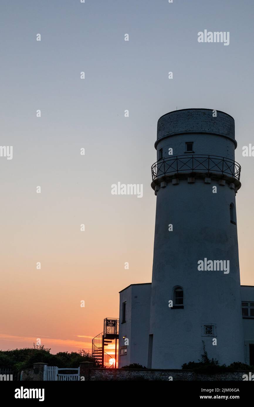 The lighthouse in Old Hunstanton at sunset Stock Photo - Alamy