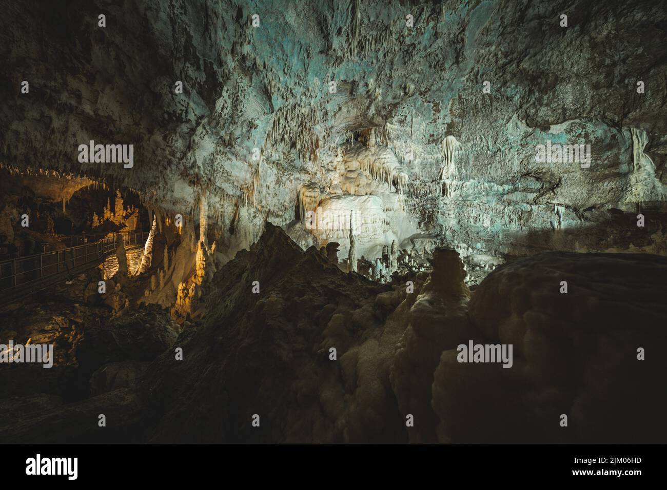 The interior of a cave with rock formations and a tunnel in Spain ...