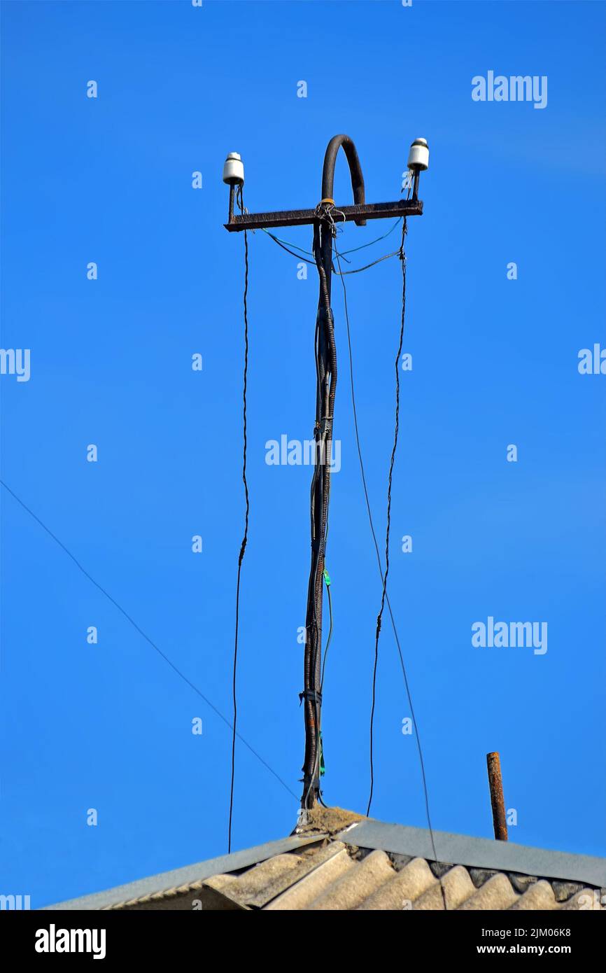 power electric pylon on the roof of building, modern electricity ...