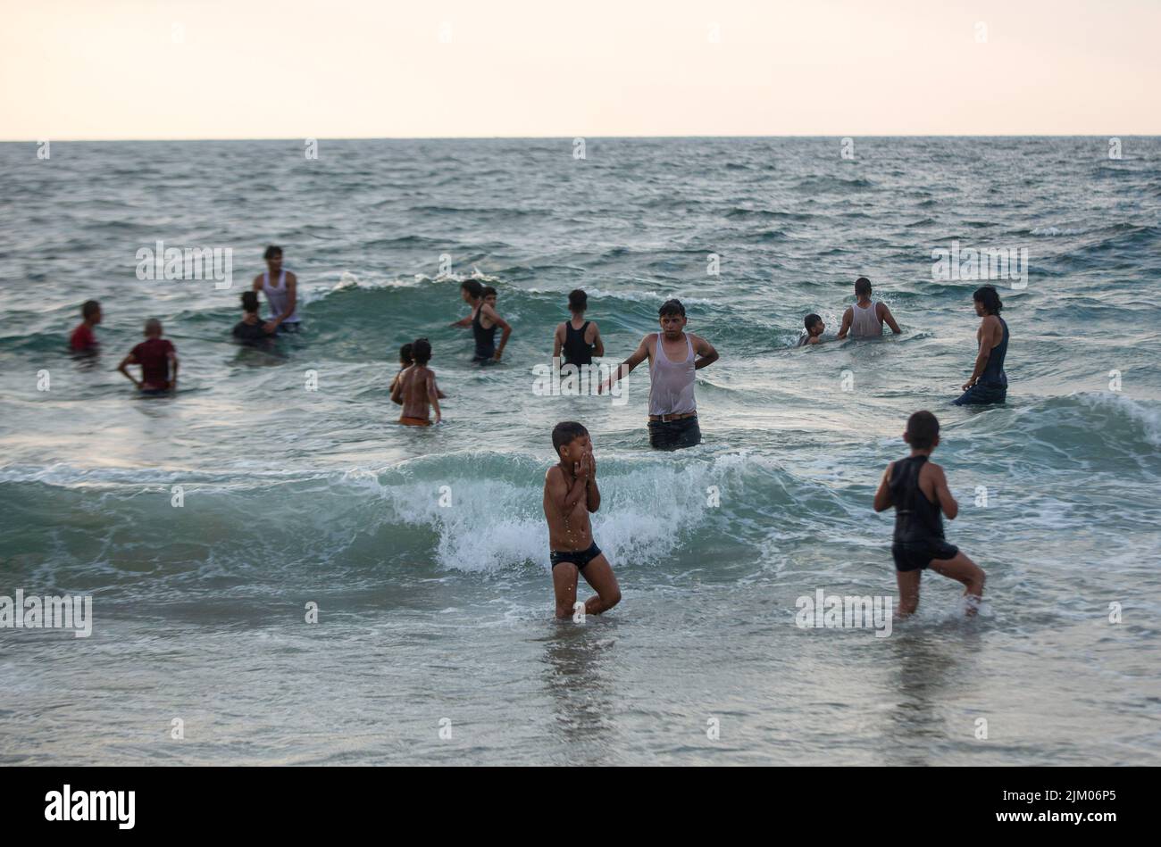 Palestinians seen bathing at the Mediterranean beach, while escaping ...