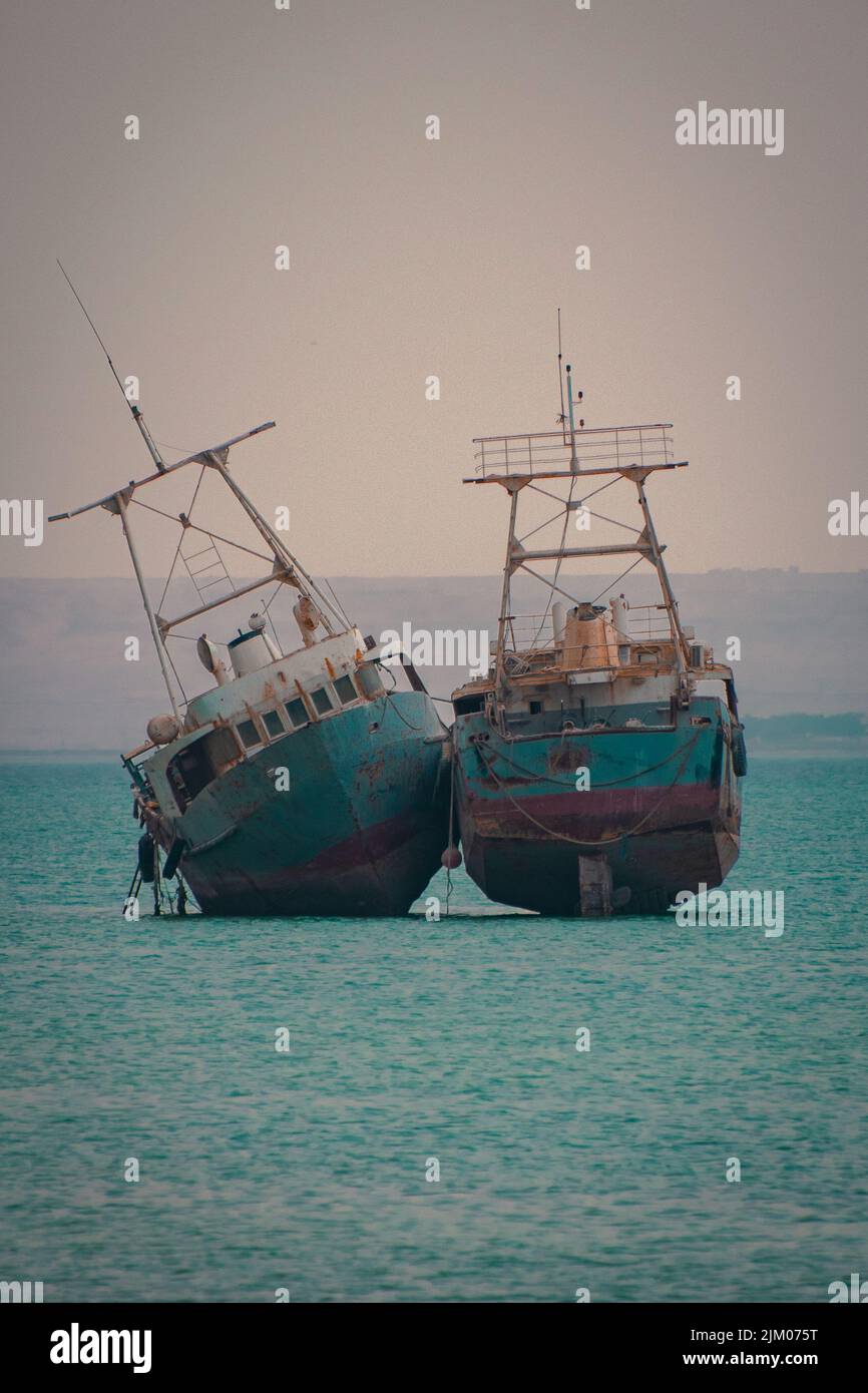 a vertical shot of two ships hitting each other in the water Stock ...