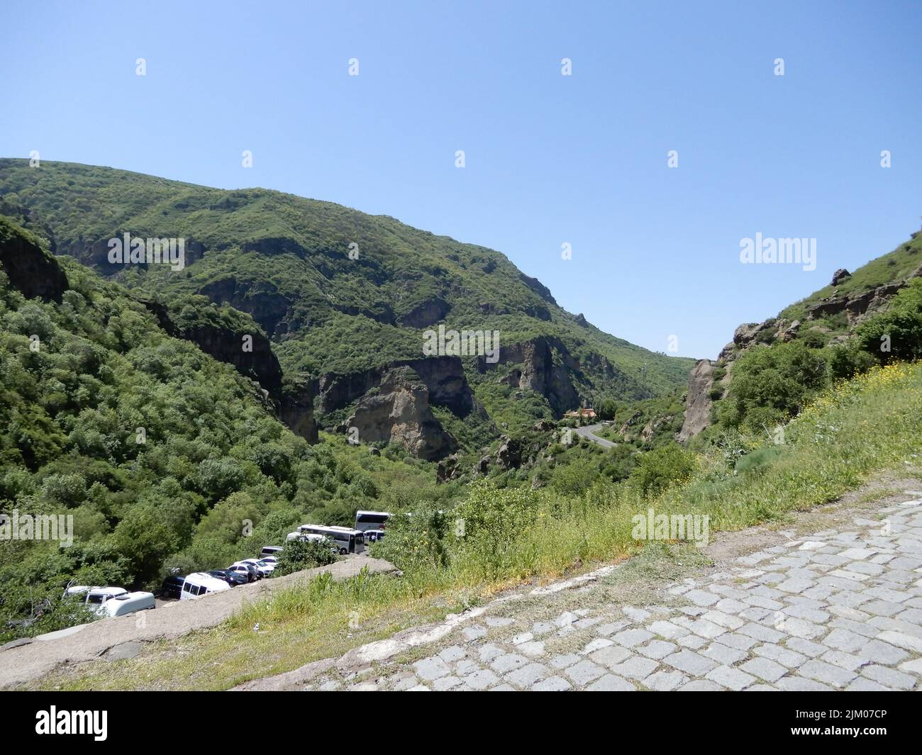 View of green hills in the countryside in the mountains with many trees ...