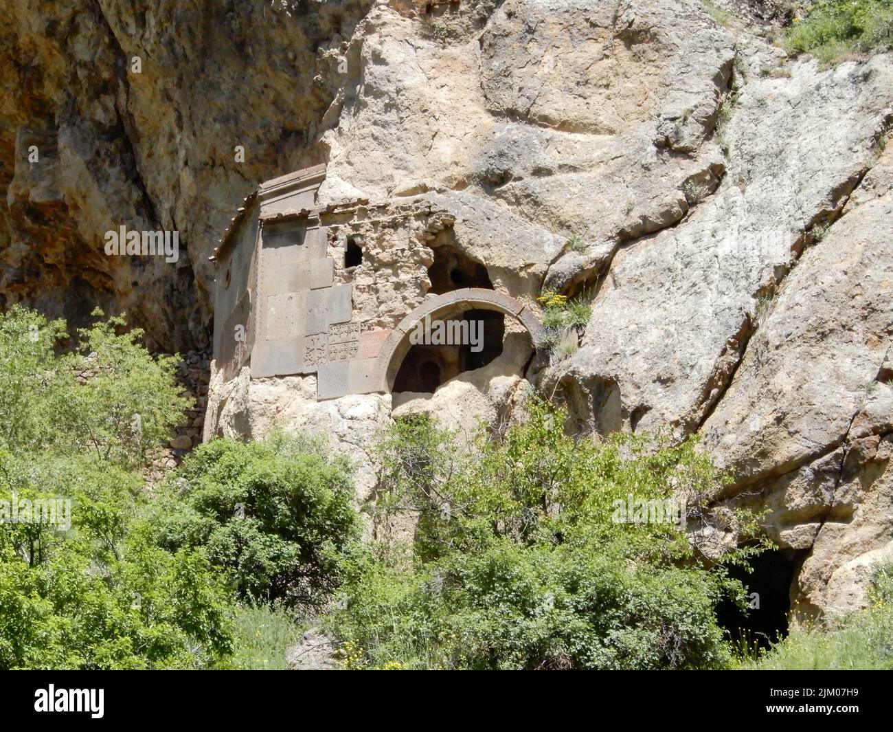 A historic Armenian cave carved inside a rocky mountain Stock Photo - Alamy
