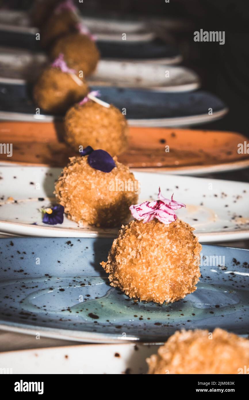 Chef finishing her plate and almost ready to serve at the table. Only ...