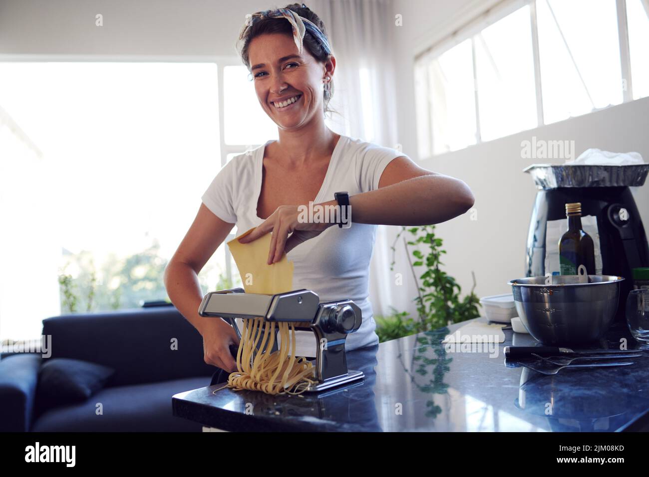 Cooking always puts a smile on my face. Cropped portrait of an ...