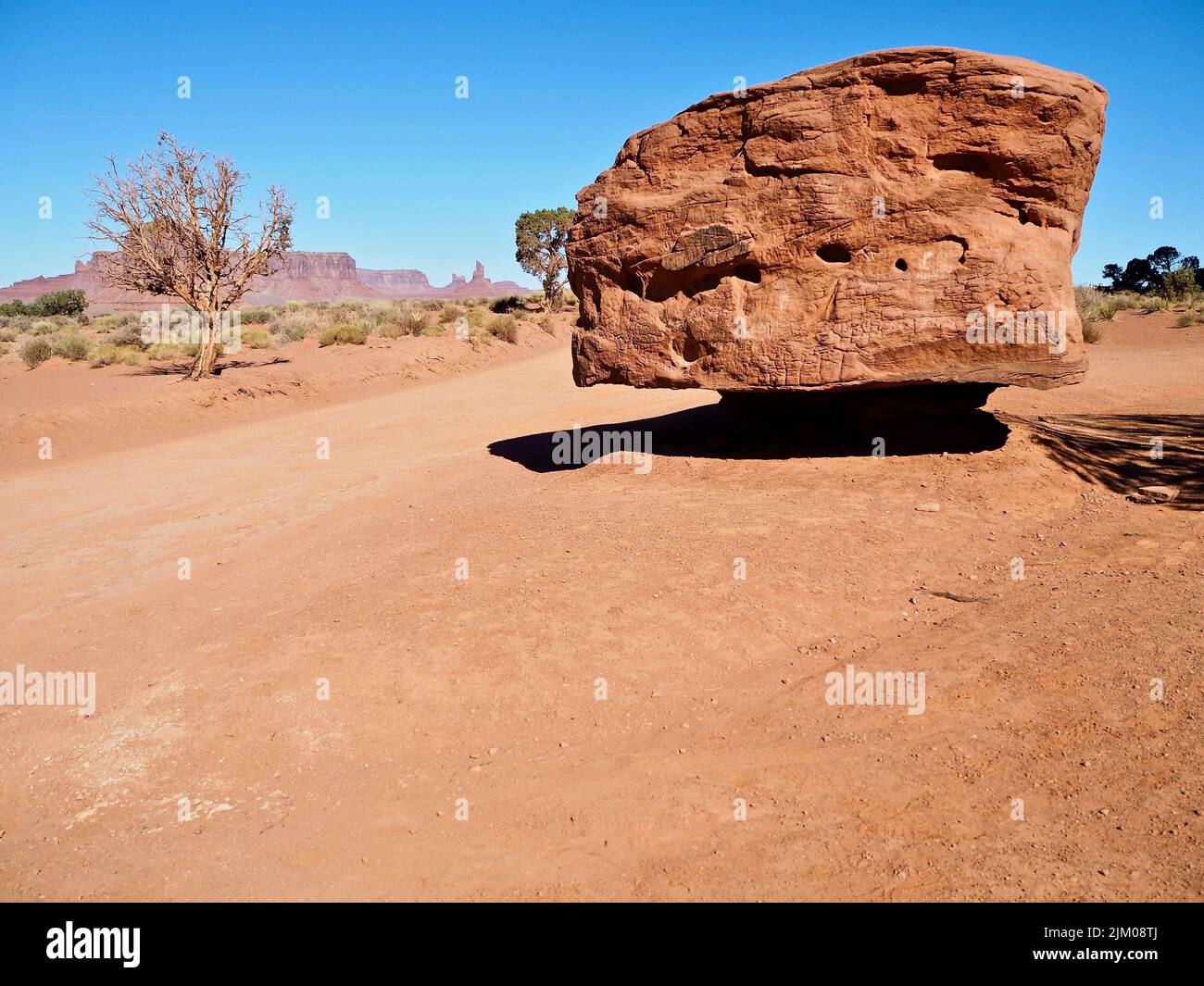 horizontal view of a massive stone in the monument valley on a bright ...