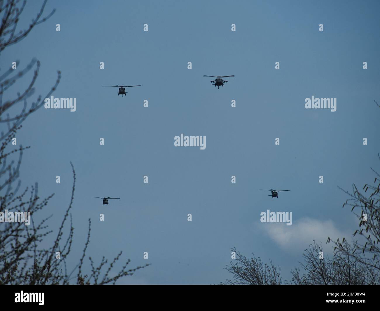 The four helicopters in formation overhead in Spring Hill, Kansas Stock ...