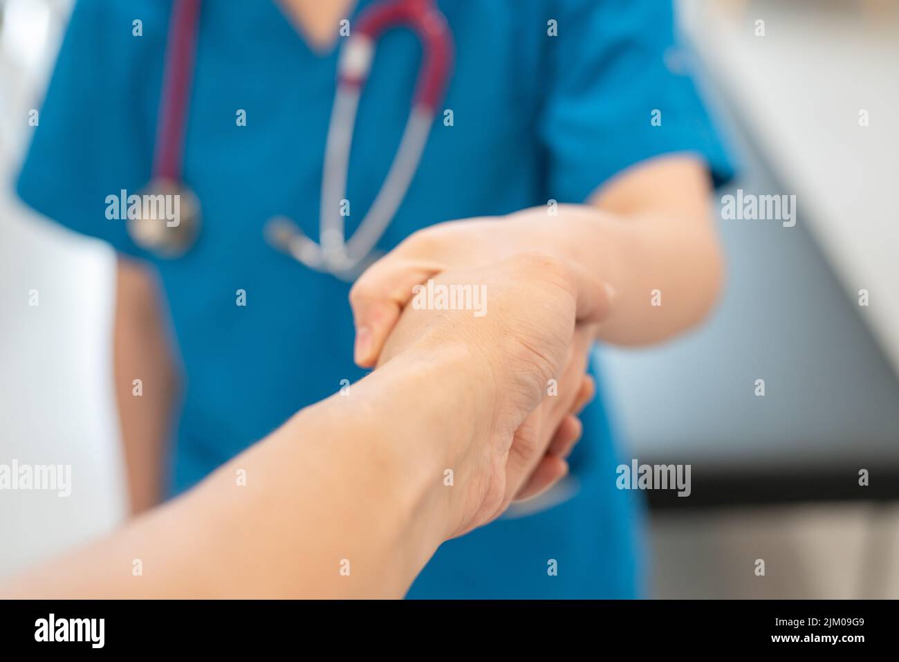 Closeup doctor patient shaking hands hi-res stock photography and ...