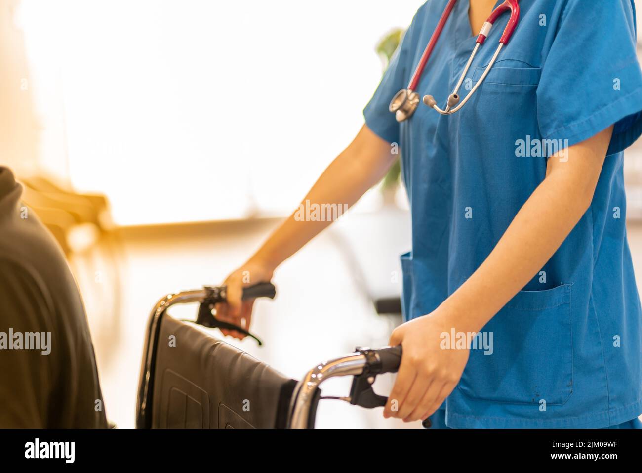 unrecognizable doctor help disable patient with wheelchair Stock Photo ...
