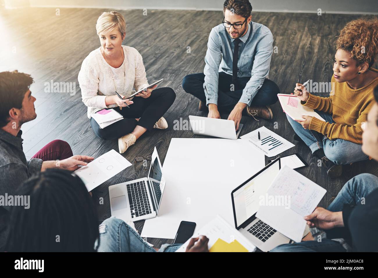 Creative and busy business people working on strategy planning and ...