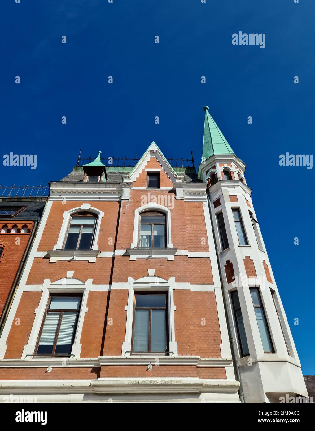 A house facade with a pointed tower in the city center of Eckernfoerde ...
