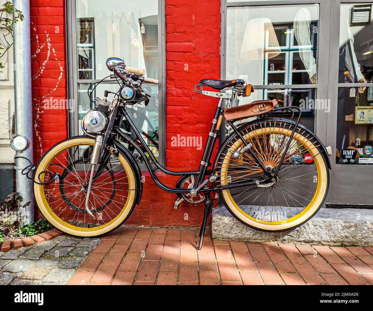 An old motorized bicycle of the brand Motorenwerke Rex on a historic ...
