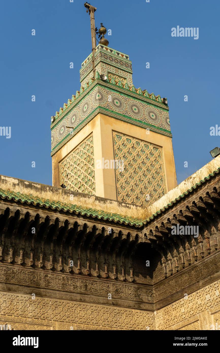 The minaret of Madrasa Bou Inania in the old medina of Fes Stock Photo ...