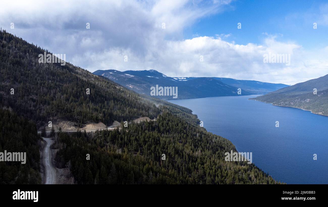 An aerial view of Adams Lake surrounded with forest, Canada Stock Photo ...