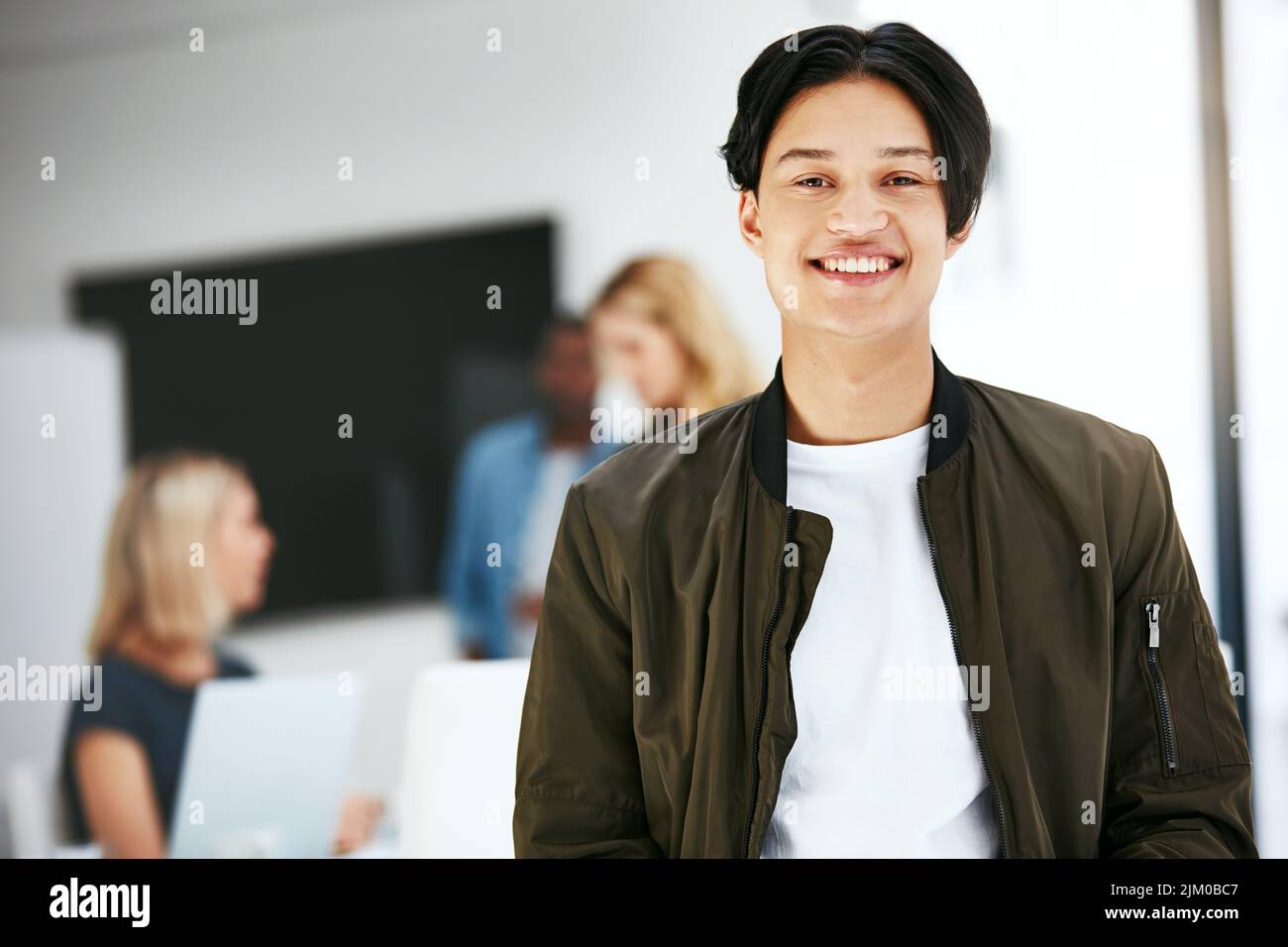 Happy, confident and carefree business man relaxing in a modern office ...