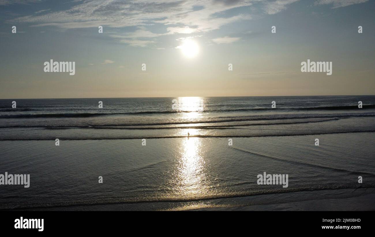 A beautiful view of sunset over an ocean Stock Photo - Alamy