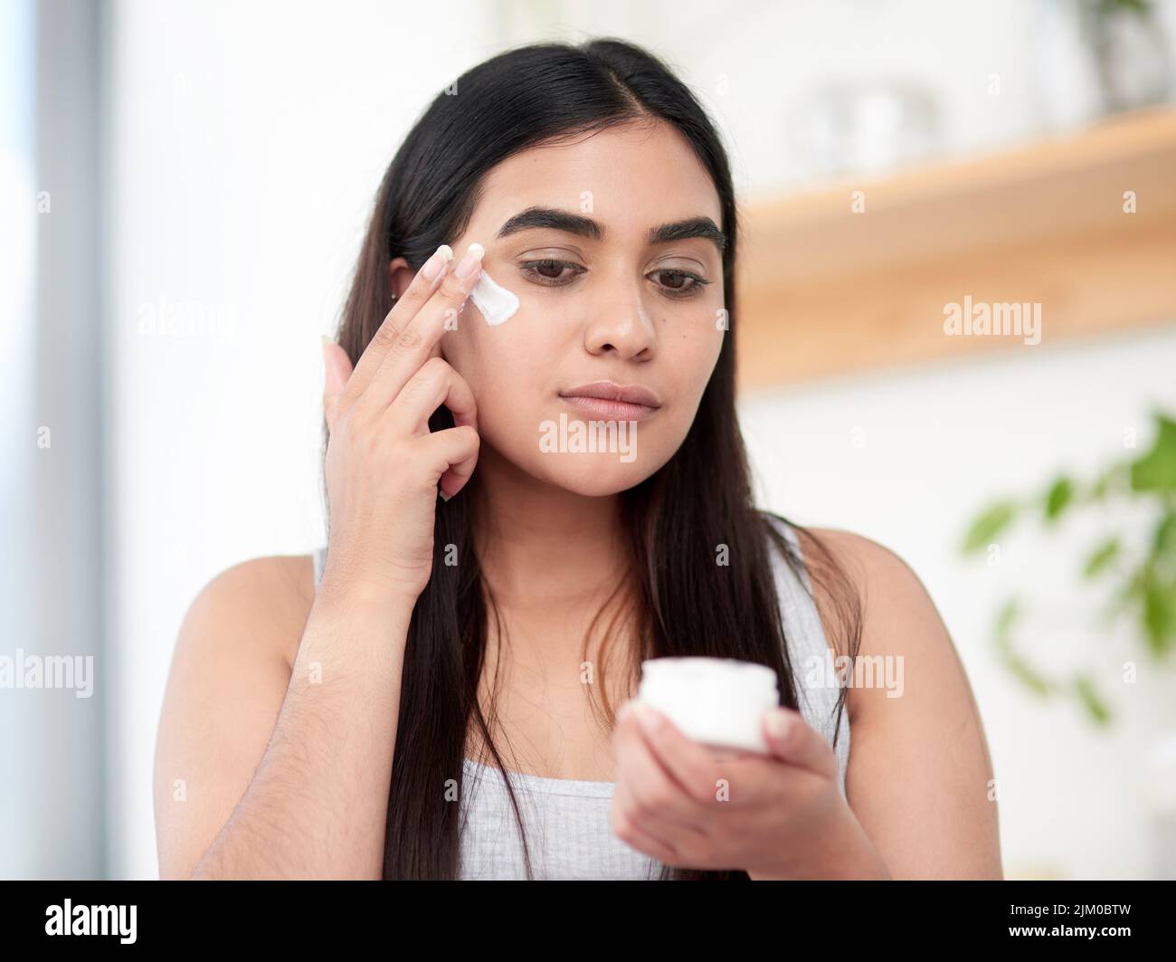 Consistency is the key to radiant, glowing skin. a gorgeous young woman ...