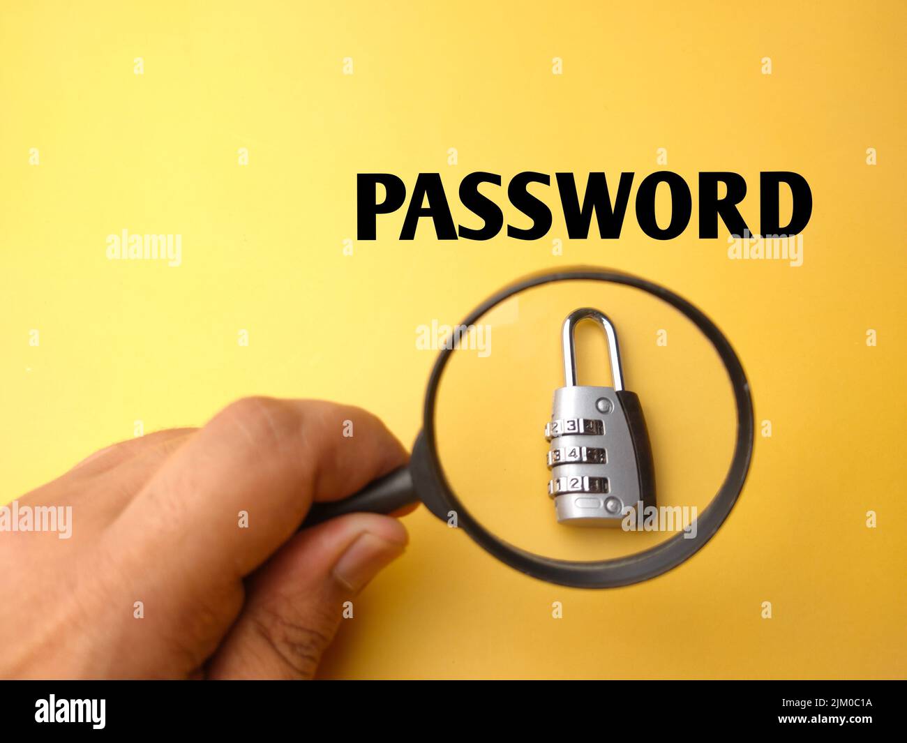 Hand holding magnifying glass with padlock and word PASSWORD Stock ...