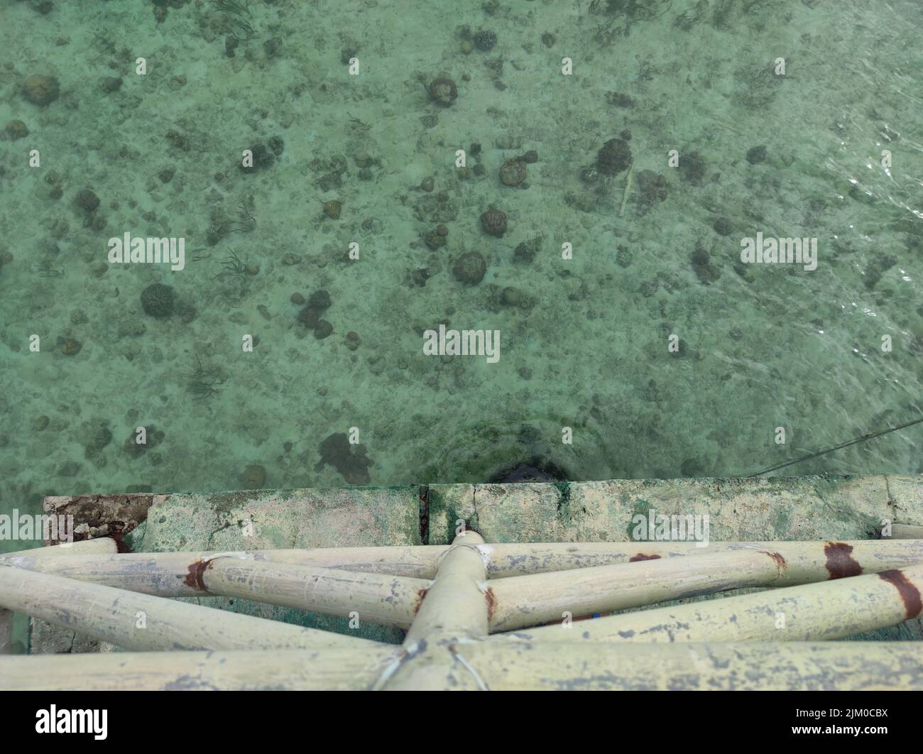 A top view of a rusty metallic construction above crystal clean ...