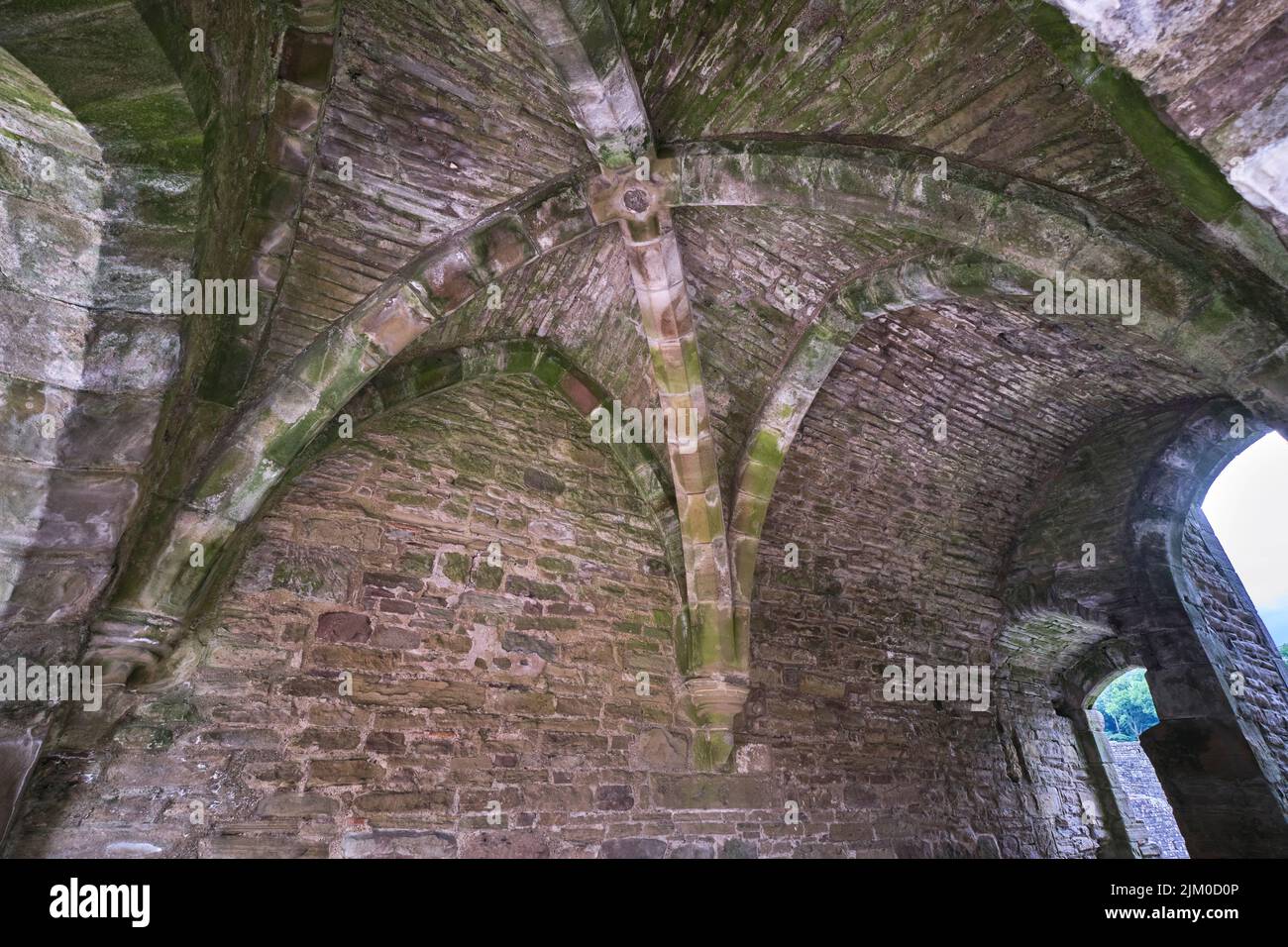 A close up, detail view of one of the double barrel stone, brick vaults ...