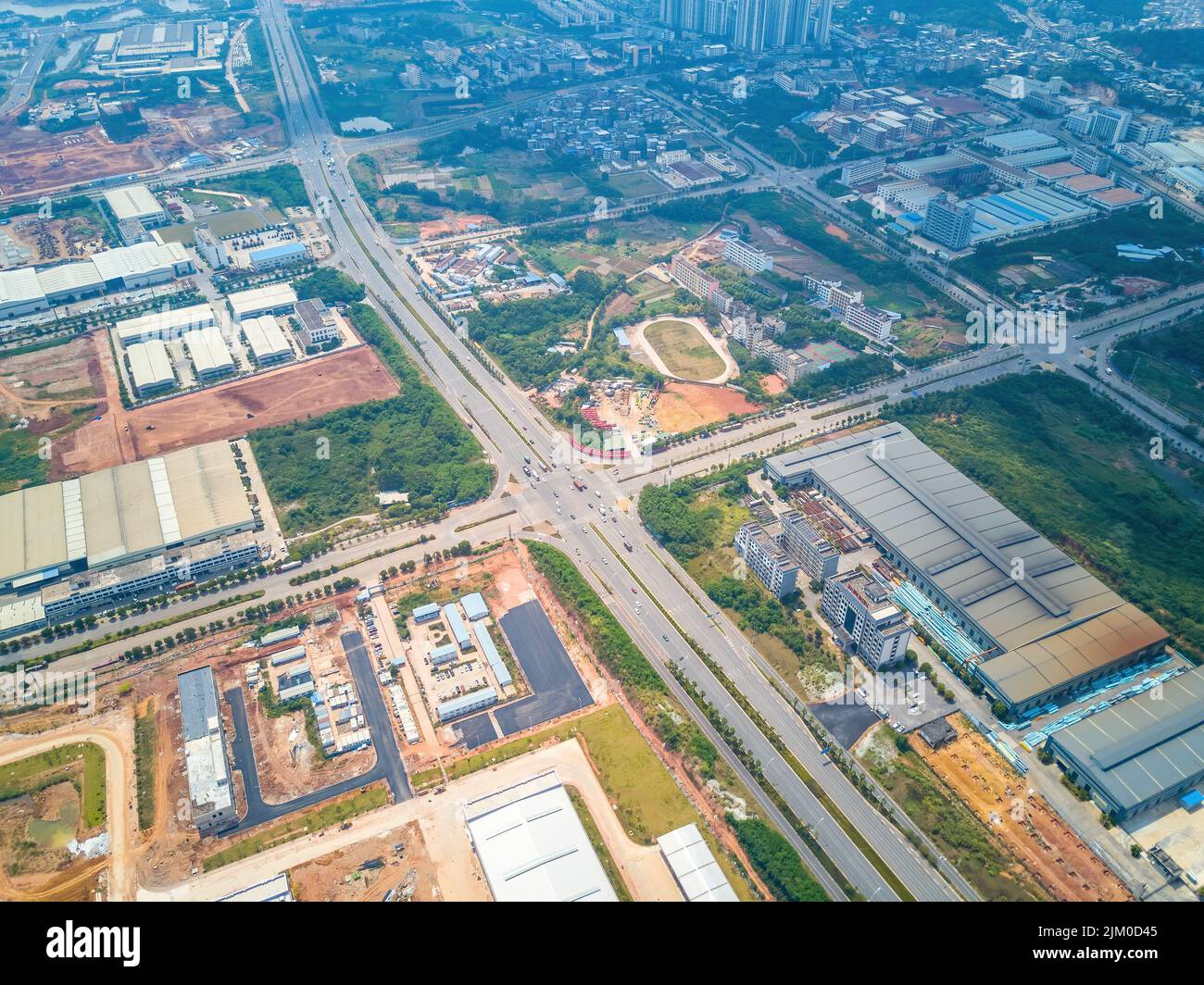 Aerial shot of road intersection in urban industrial area Stock Photo ...