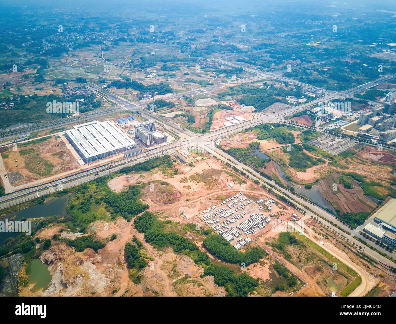 Aerial shot of road intersection in urban industrial area Stock Photo ...
