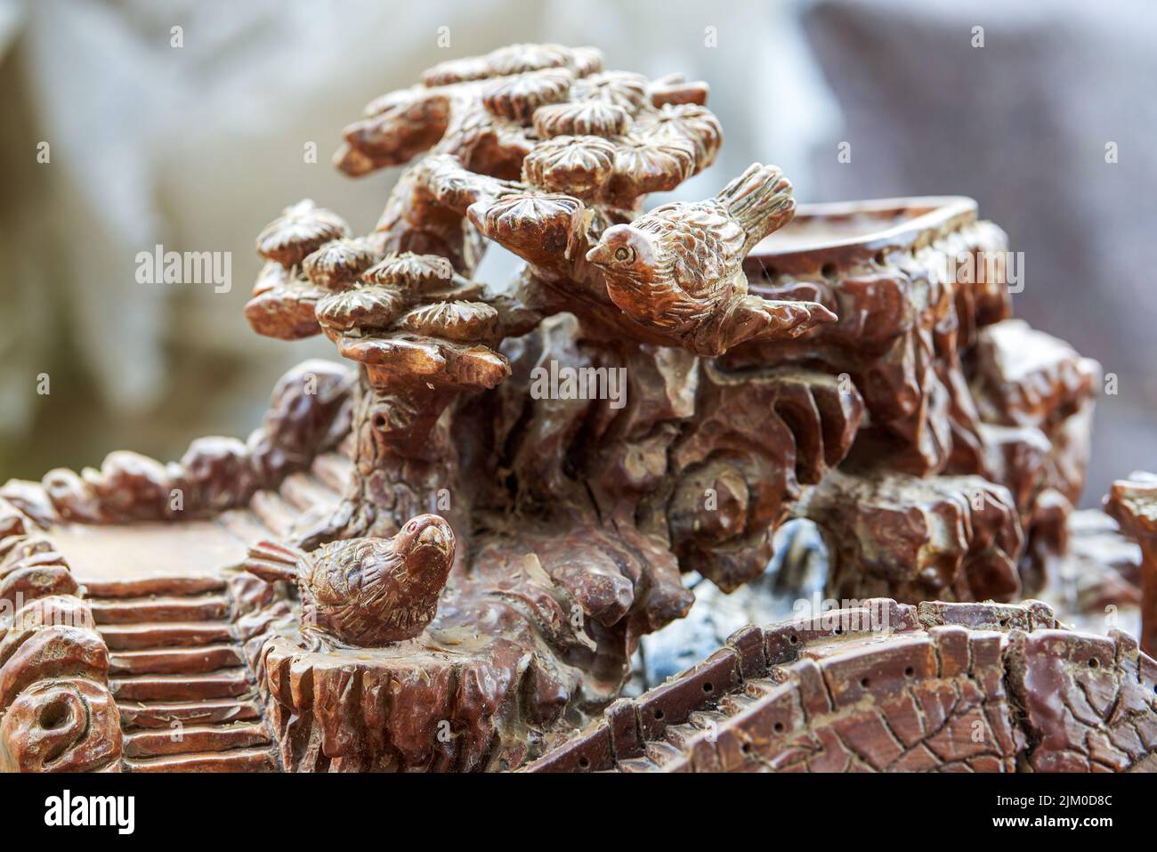 A piece of delicate bird and cloud pine wood carving Stock Photo - Alamy