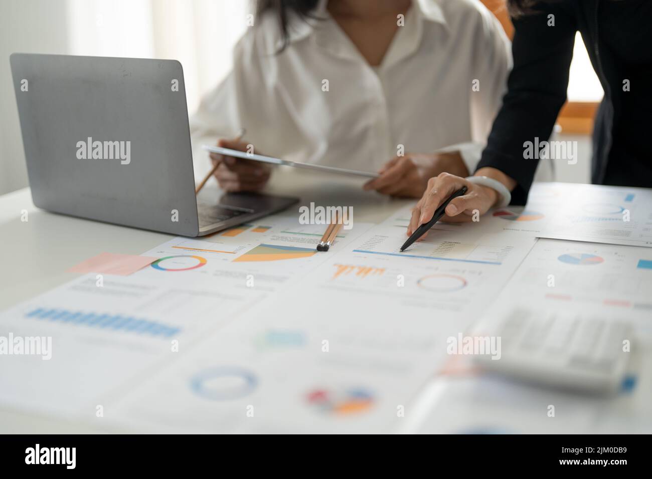 Business People Meeting to discuss and brainstorming financial report paperwork in office ...