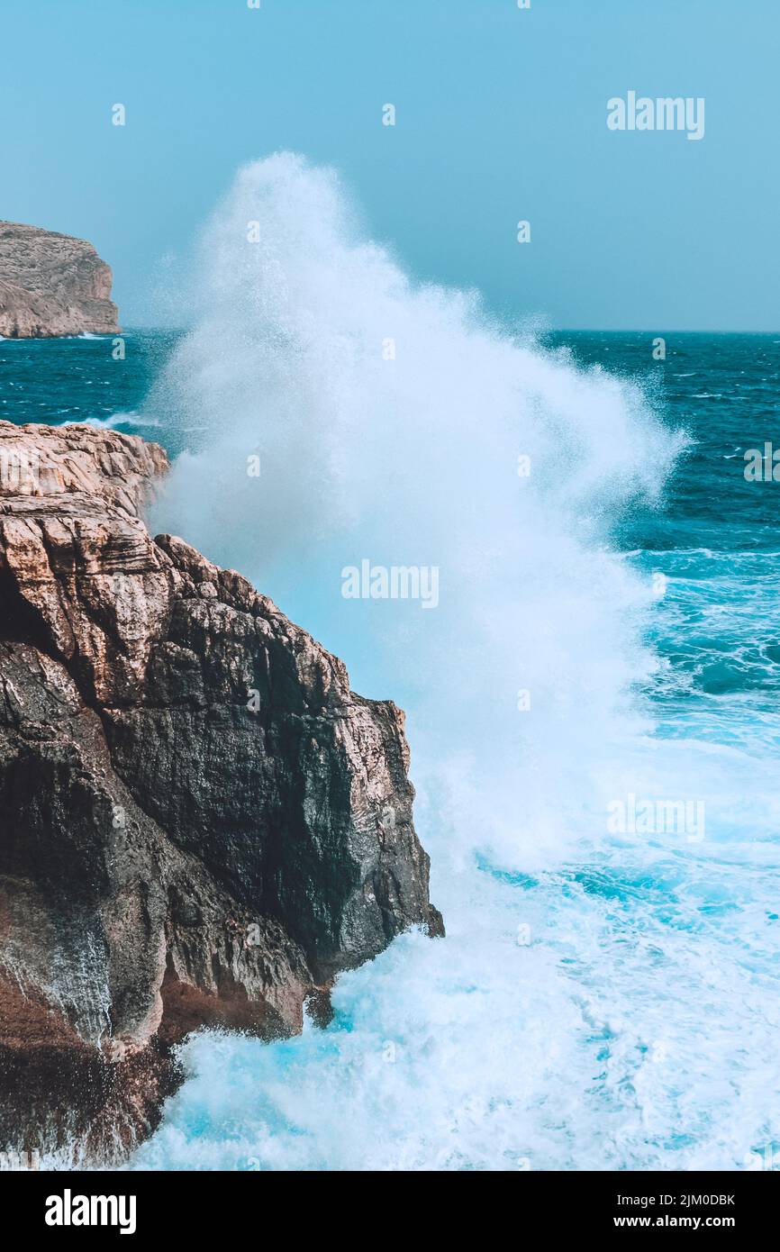 A wave crushing the rock in Malta Island Stock Photo - Alamy