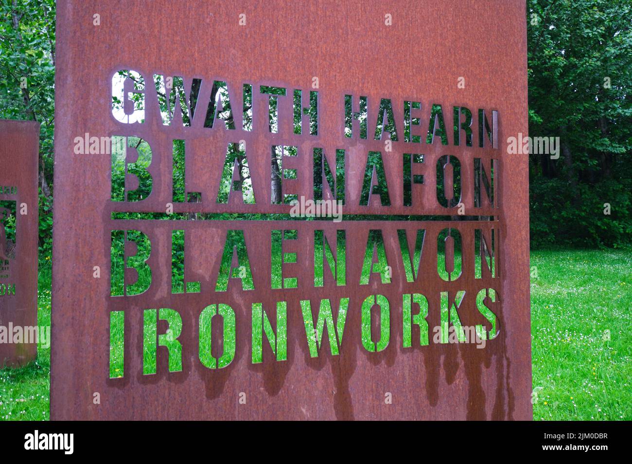 A metal, steel, rusted cutout sign, marking the entrance to the museum ...