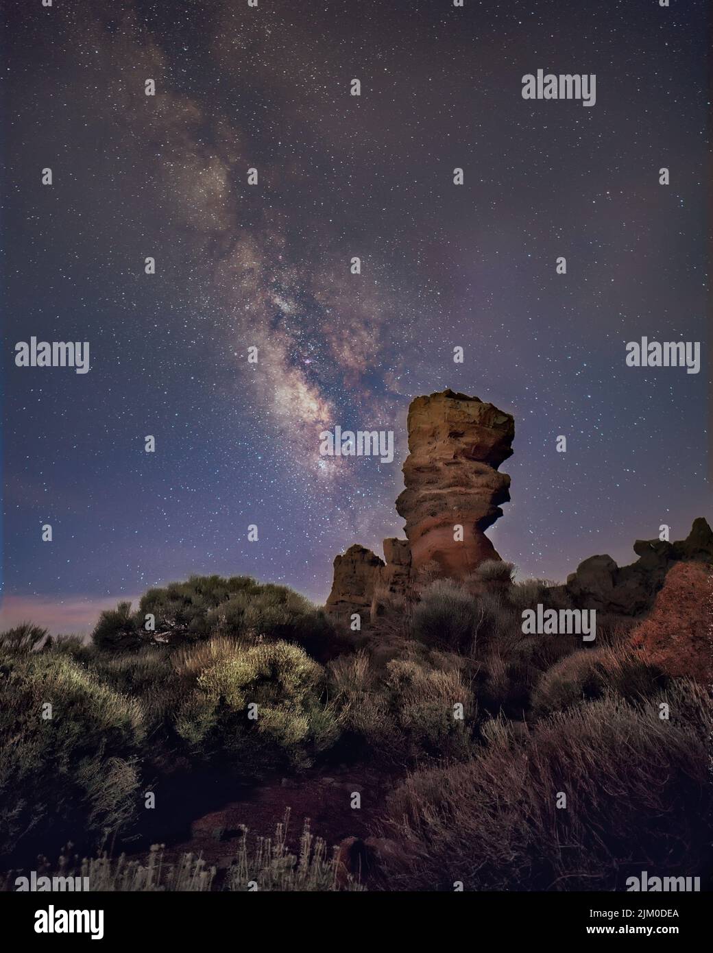 A rocky hill under the starry night Stock Photo - Alamy